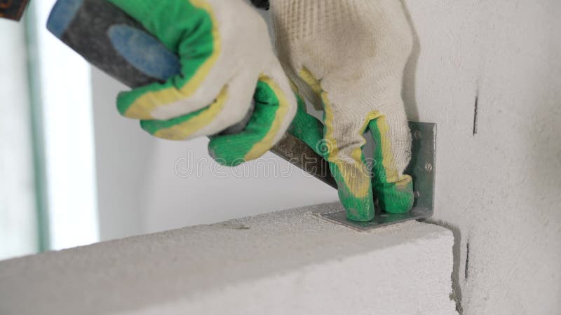 Builder Laying a Wall of Gas Blocks with Tools and Adhesive Mortar ...
