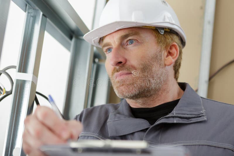 Builder or Maintenance Man with Clipboard Stock Image - Image of ...
