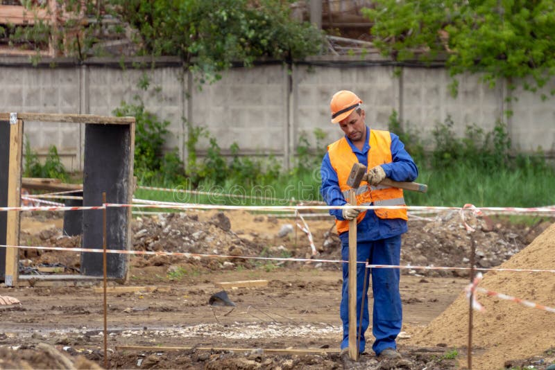 Builder Makes a Fence at the Construction Site Editorial Stock Photo ...