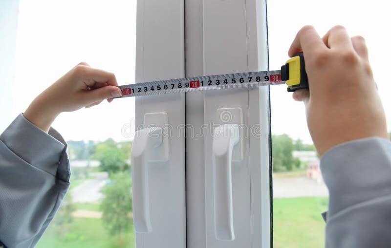 The Builder Measures the Window Frame . Stock Photo - Image of glazing, manual: 197603042
