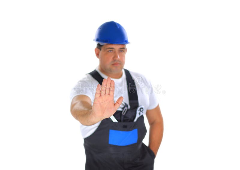 Builder making stop sign stock image. Image of showing - 22135375