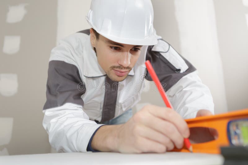Builder Making Sure Wall Straight Stock Photos - Free & Royalty-Free ...