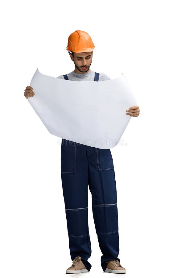 A Builder Male on a White Background Look at the Blueprint Stock Photo ...