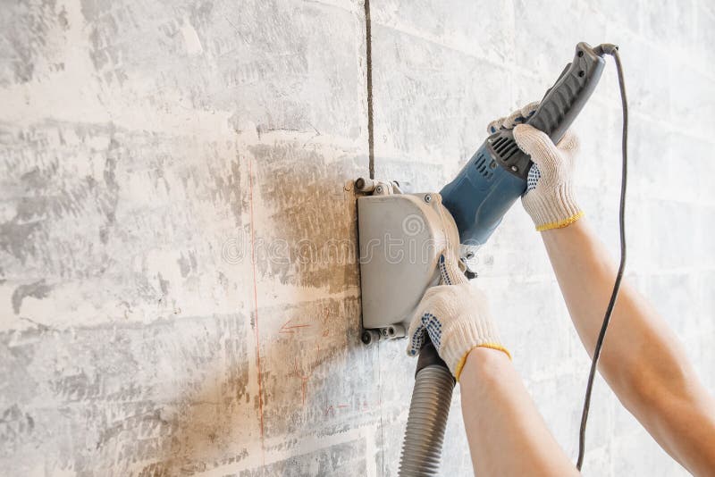 Builder Man Cutting Electrical Chase in Concrete Wall with Groove ...