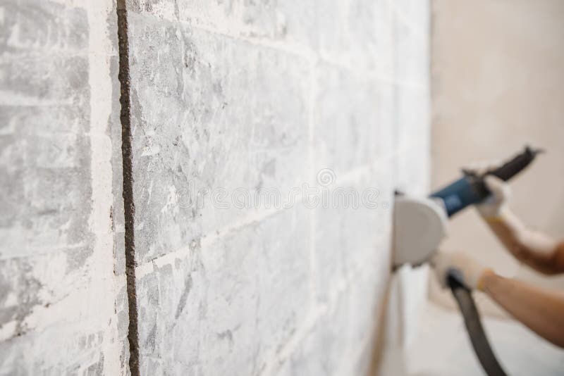 Builder Man Cutting Electrical Chase in Concrete Wall with Groove ...