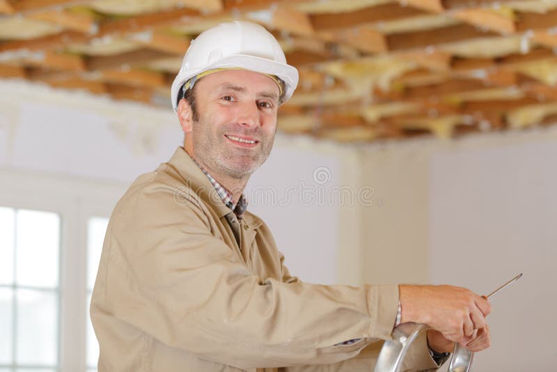 Builder Man in Helmet Next To Ladder Stock Image - Image of beard, wall ...