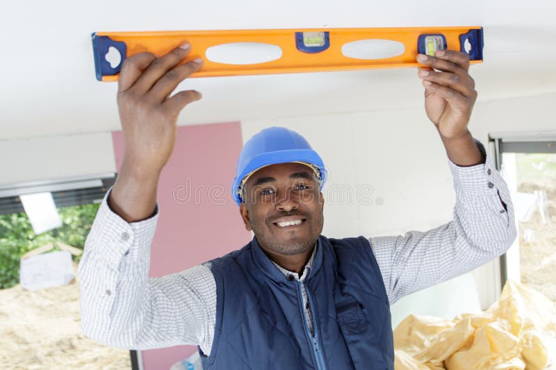 Builder man holding level stock image. Image of media - 316709007