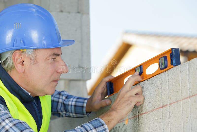 Builder man with level stock image. Image of repairman - 257188795