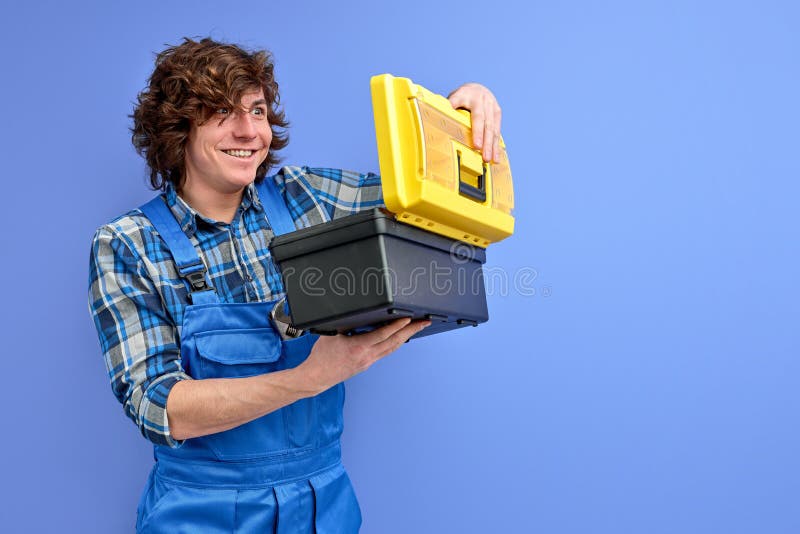 Young Caucasian Curly Builder Man Opening Tools Box Stock Photo - Image ...