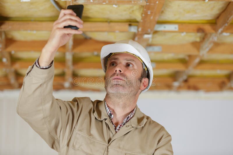Builder on mobile phone stock image. Image of working - 21649259