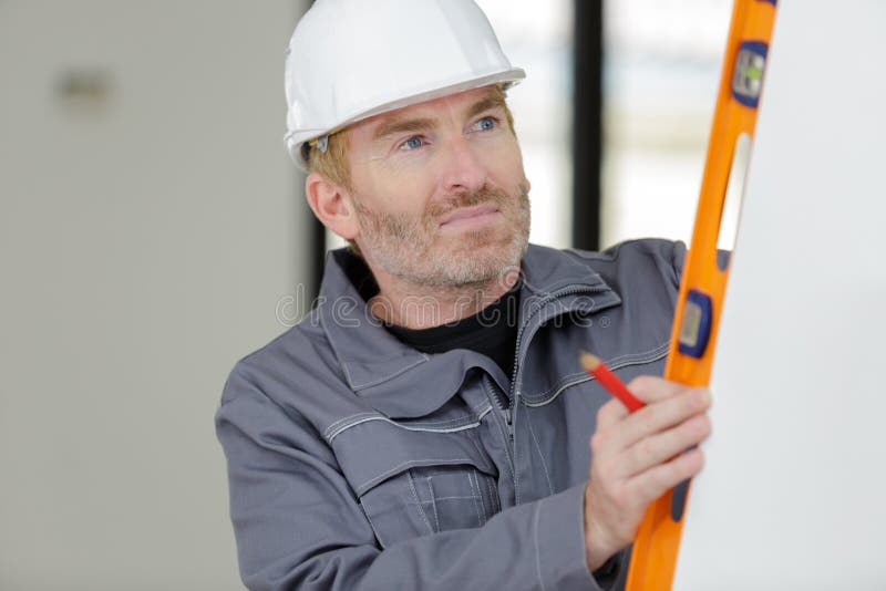 Builder Man Working Leveling Wall Stock Photo - Image of smile ...