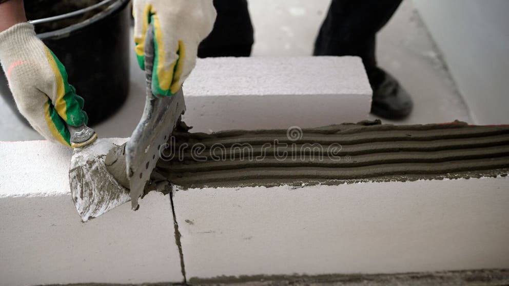 Builder-mason Working with Aerated Concrete Blocks. Building Walls ...