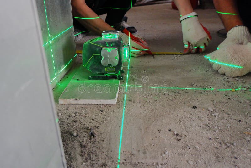 The Builder Measures the Repair Lines Using a Green Laser Level Stock ...
