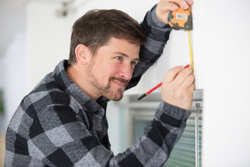 Builder Measuring Window Using Tape Measure and Pencil Stock Photo ...