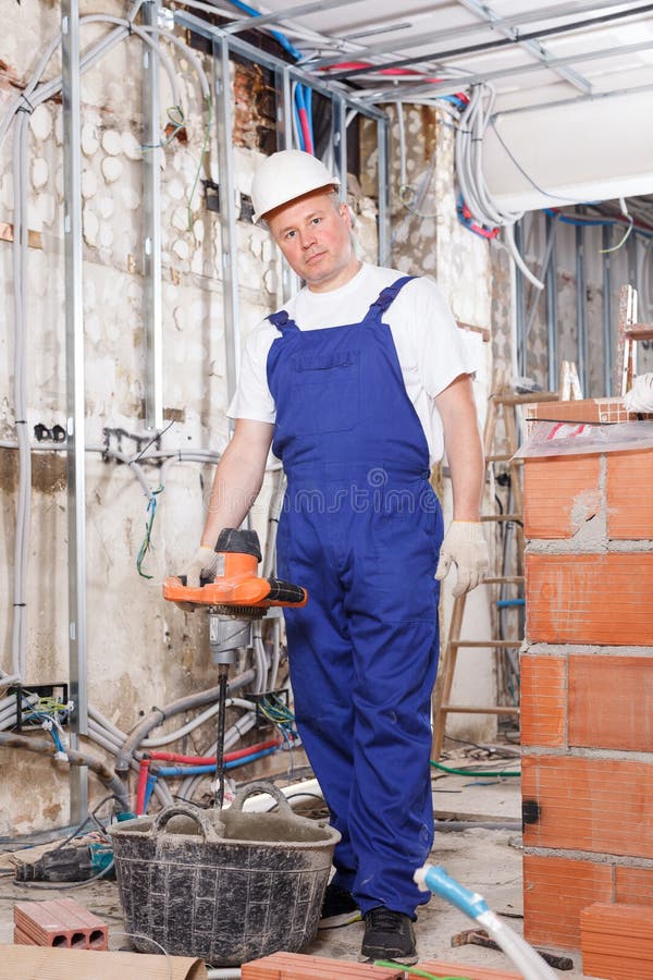 Builder mixing plaster stock image. Image of male, putty - 239912017