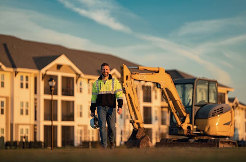 Builder Near Excavator. Builder Worker with Excavator. Builder in ...