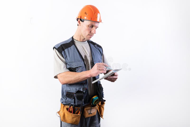Builder with a Notepad. in a Helmet and a Robe Stock Photo - Image of ...