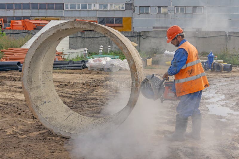 Builder in Orange Uniform with a Concrete Cutter Stock Image - Image of ...