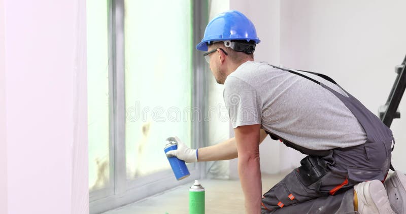 Builder Painted Layer of PVC Windows with White Spray Paint Stock Video ...