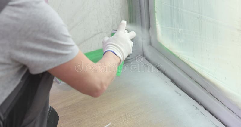Builder Paints a Window Layer with White Spray Paint Stock Video ...