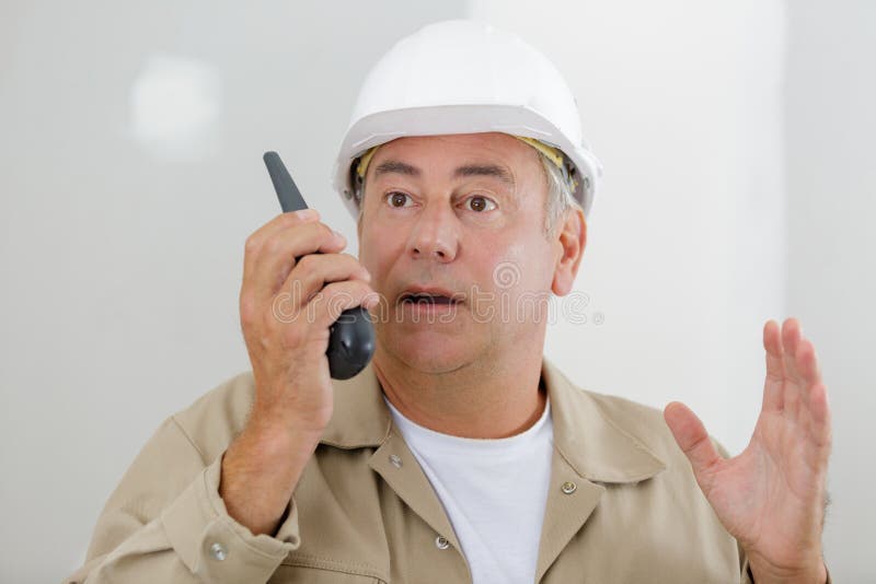 Builder on phone stock photo. Image of caucasian, blue - 208666498