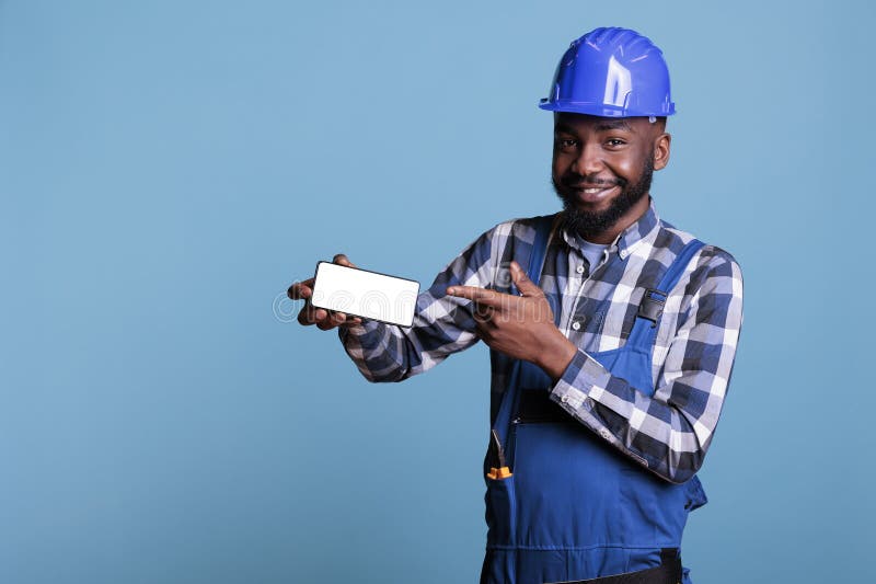 Builder Pointing Finger at Cell Phone Screen Stock Photo - Image of ...