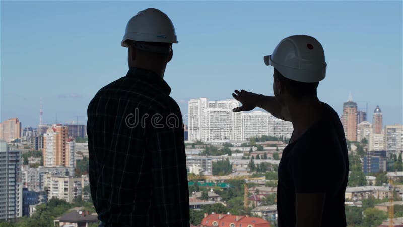 Builder Points His Hand at the Complex of High Buildings Stock Footage ...