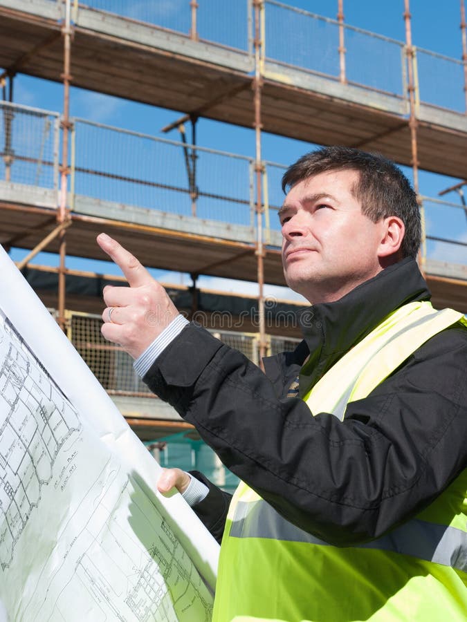 Builder Points Up at Construction Site Stock Image - Image of ...