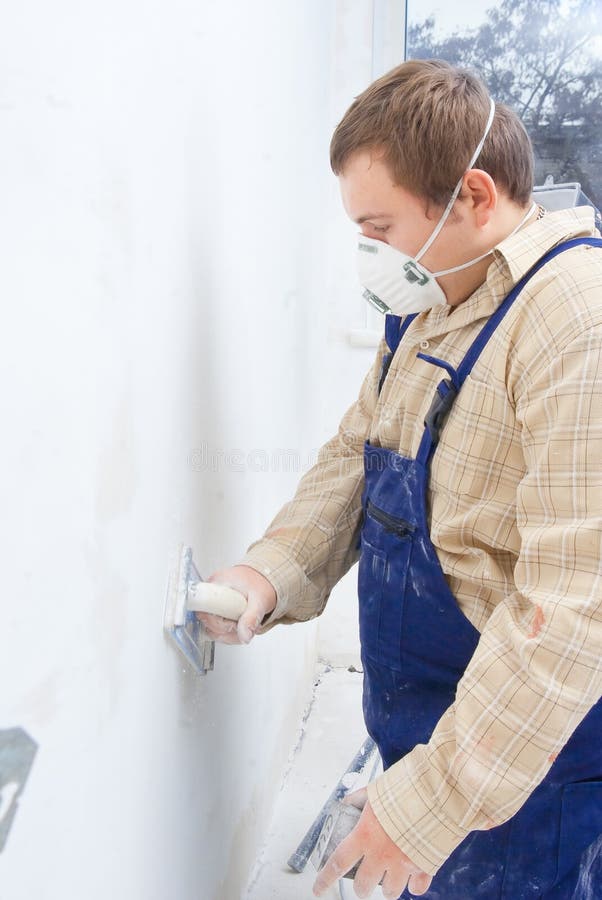 Builder Polishing the Wall. Stock Image - Image of master, tool: 16926115
