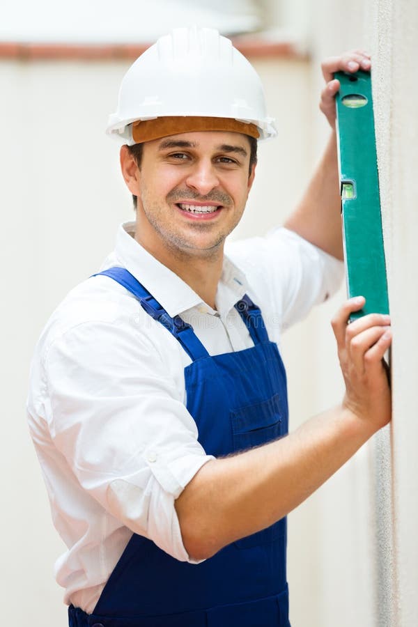 Builder Posing with Spirit Level Stock Photo - Image of build, measure ...