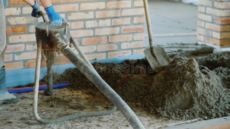 The Builder Puts a Semi-dry Mortar for Finishing the Floor Stock Video ...