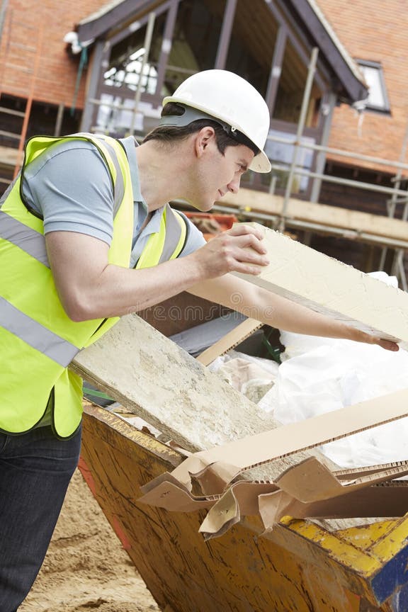 Builder Putting Waste into Rubbish Skip Stock Photo - Image of skip ...