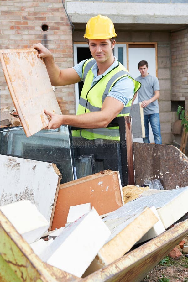 Builder Putting Waste into Rubbish Skip Stock Photo - Image of ...
