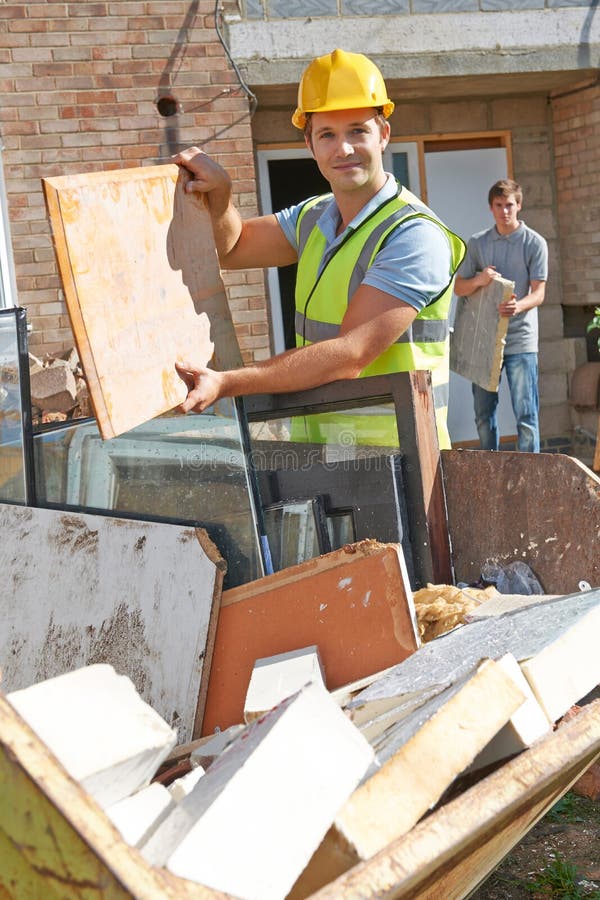 Builder Putting Waste into Rubbish Skip Stock Photo - Image of looking ...
