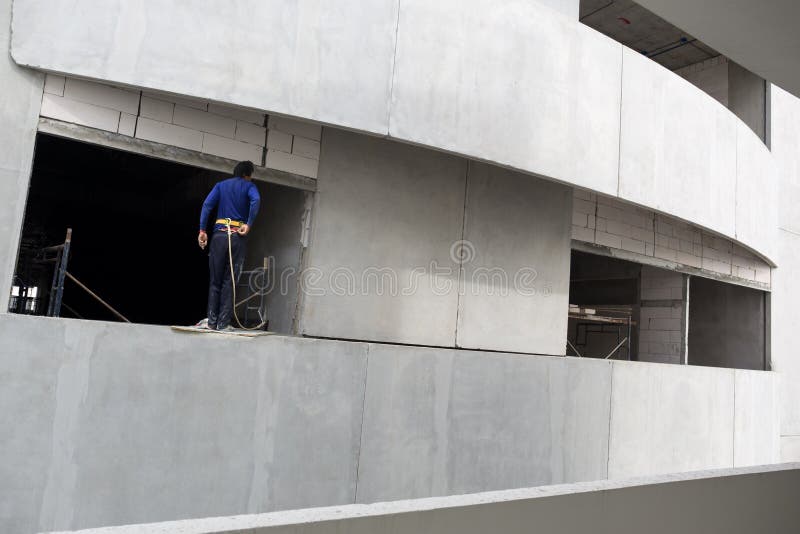 Builder with Rope at High Building Editorial Photo - Image of ...