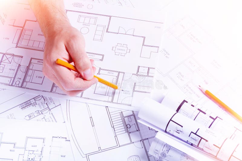 Builder& X27;s Hands on the Background of a House Plan. Construction ...