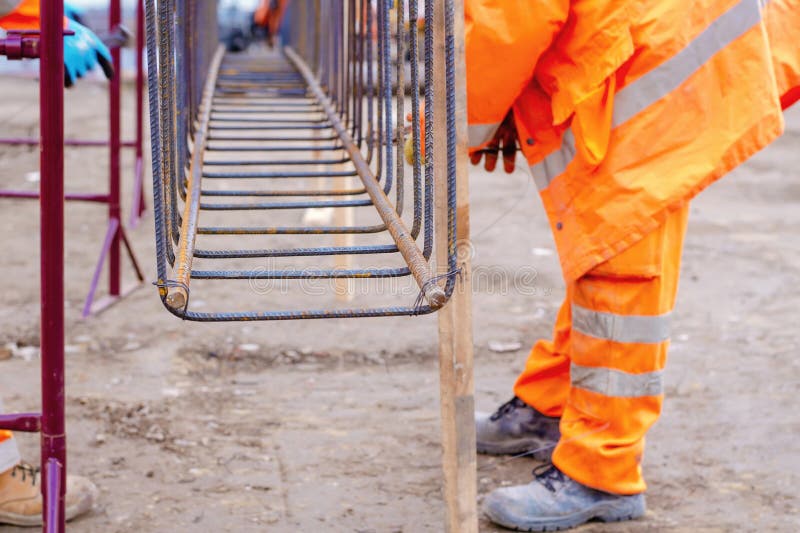 Builder S Hands Fixing Steel Reinforcement Bars at Construction Site ...