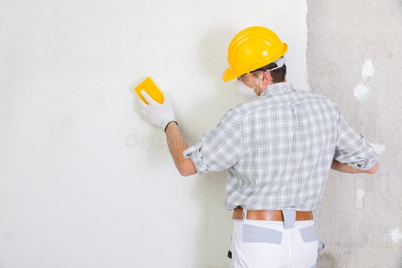 Builder Sanding and Smoothing Newly Plastered Wall Stock Image - Image ...