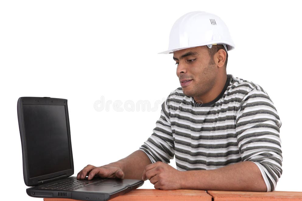 Builder sat using laptop stock photo. Image of journeyman - 37034276
