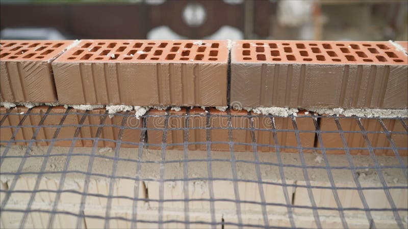 The Builder Sets the Grid during the Construction of a House of Brick ...