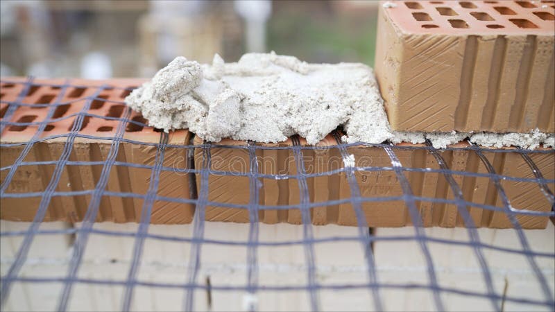 The Builder Sets the Grid during the Construction of a House of Brick ...
