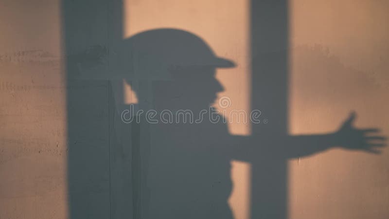 Builder Shadow Falls on the Wall Silhouette. Business Building Concept ...