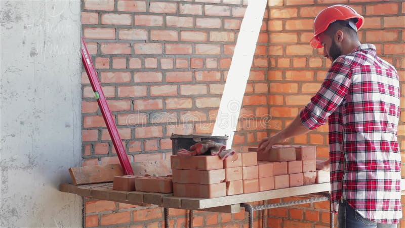 Builder Shifts Bricks at the Building Under Construction Stock Footage ...
