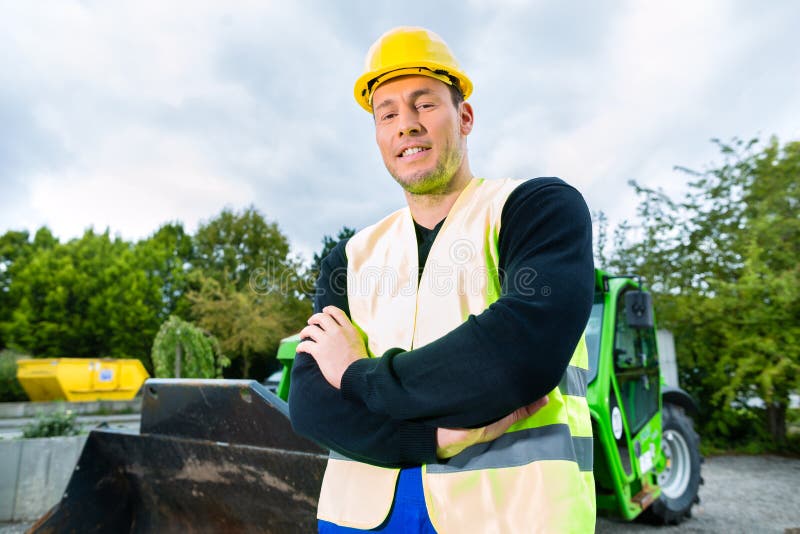 Builder on Site in Front of Construction Machinery Stock Image - Image ...