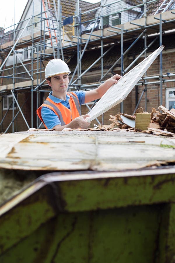 Builder on Site Putting Waste into Rubbish Skip Stock Image - Image of ...