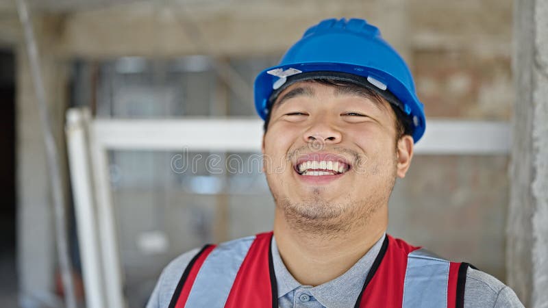 Builder Smiling Confident Standing at Construction Site Stock Photo ...