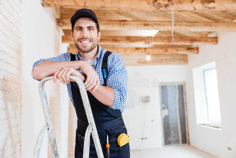 Builder Smilling and Holding Pc Tablet in His Hands Stock Image - Image ...