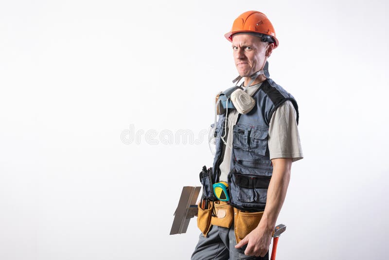 Builder with a Spatula. with a Funny Face. in Work Clothes and Hard Hat ...