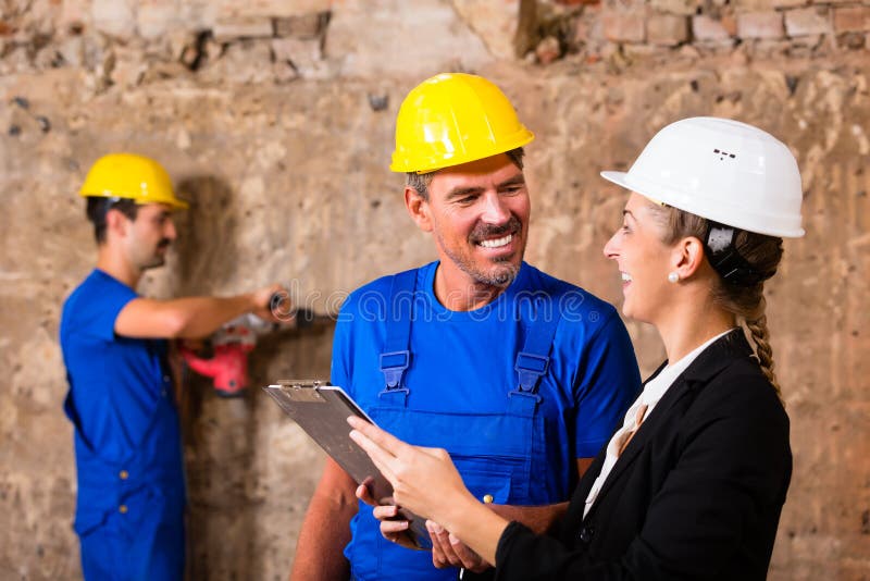 Builder and Supervisor on Construction Site Stock Photo - Image of ...