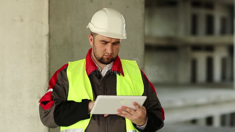 Builder with Tablet Computer on Construction Site Stock Video - Video ...